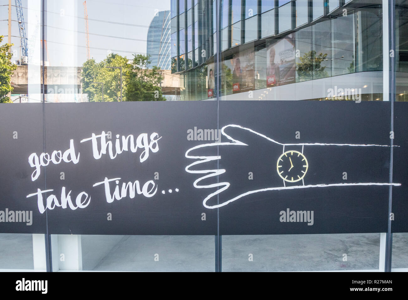 Sign on construction site - good things take time Stock Photo - Alamy