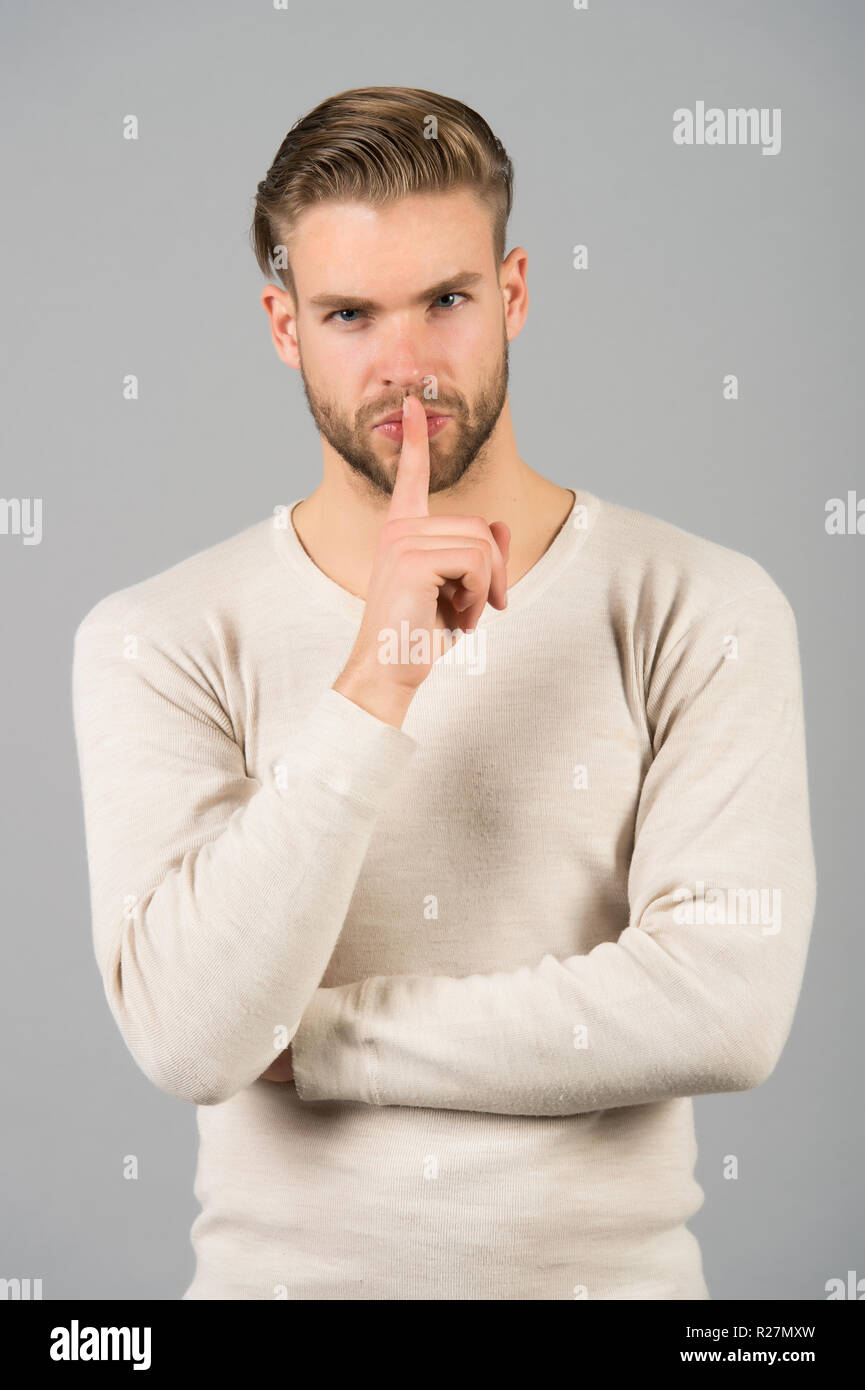 Keep silence. Man handsome attractive silence gesture. You better keep ...