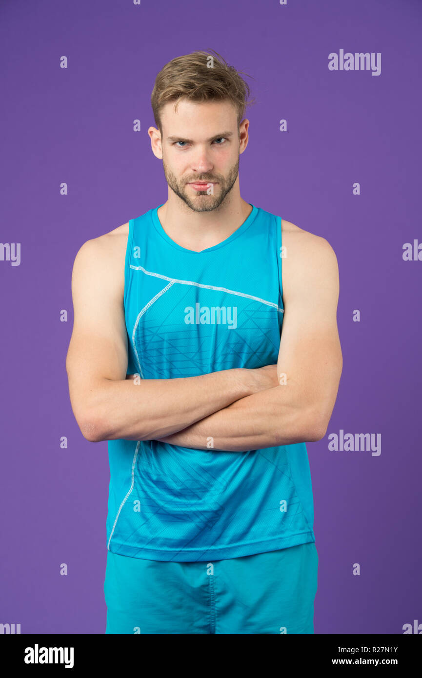 Proud to be strong. Man sporty outfit looks serious and strict with ...
