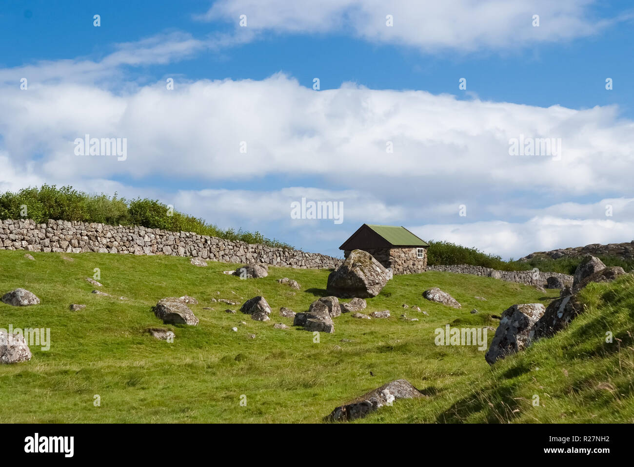Farmhouse in Torshavn, Denmark. Old stone house in farm yard on cloudy ...
