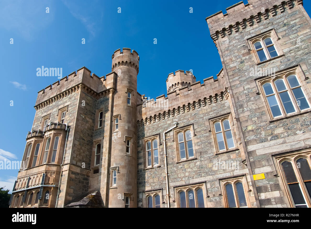 Castle building with towers on sunny blue sky. Lews Castle in Stornoway ...