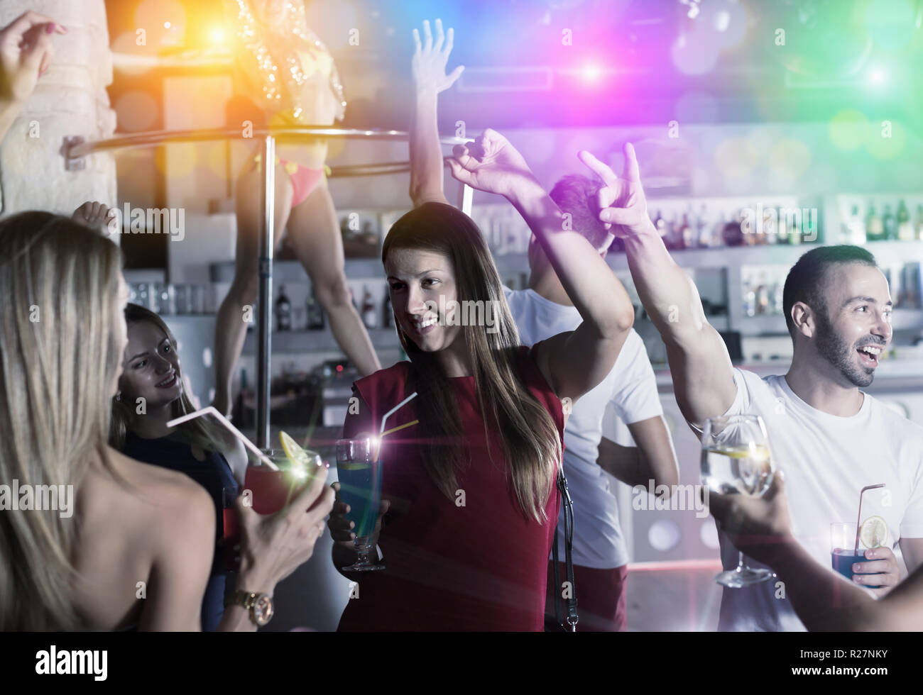 Group of glad people clubbing in the night club with drink Stock Photo ...