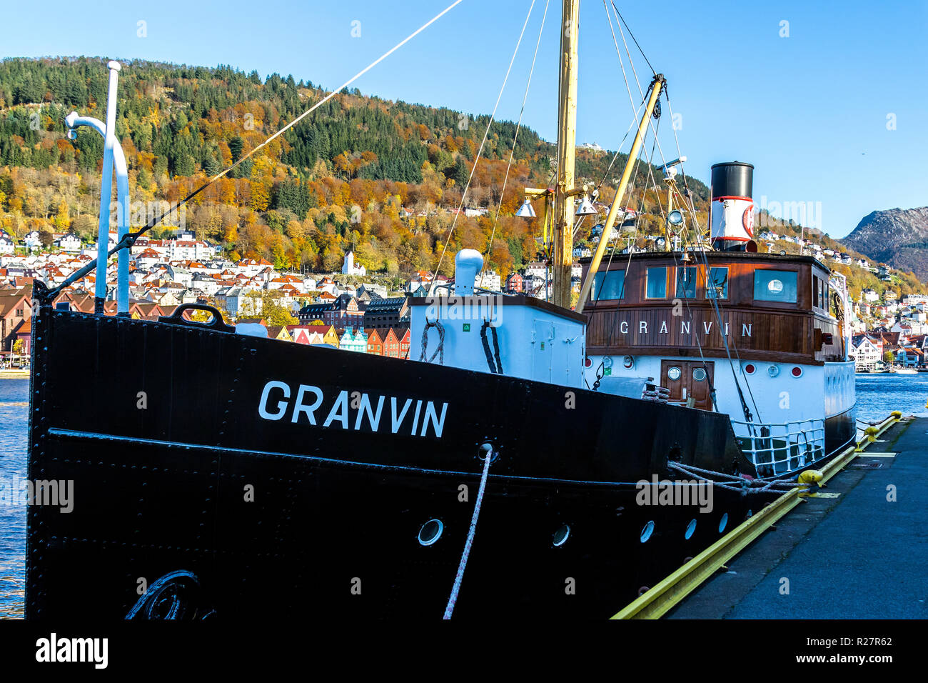 Veteran steamship Granvin in the port of Bergen, Norway. Mount Floyen ...