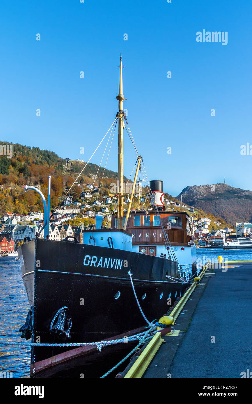 Veteran steamship Granvin in the port of Bergen, Norway. Mount Floyen ...