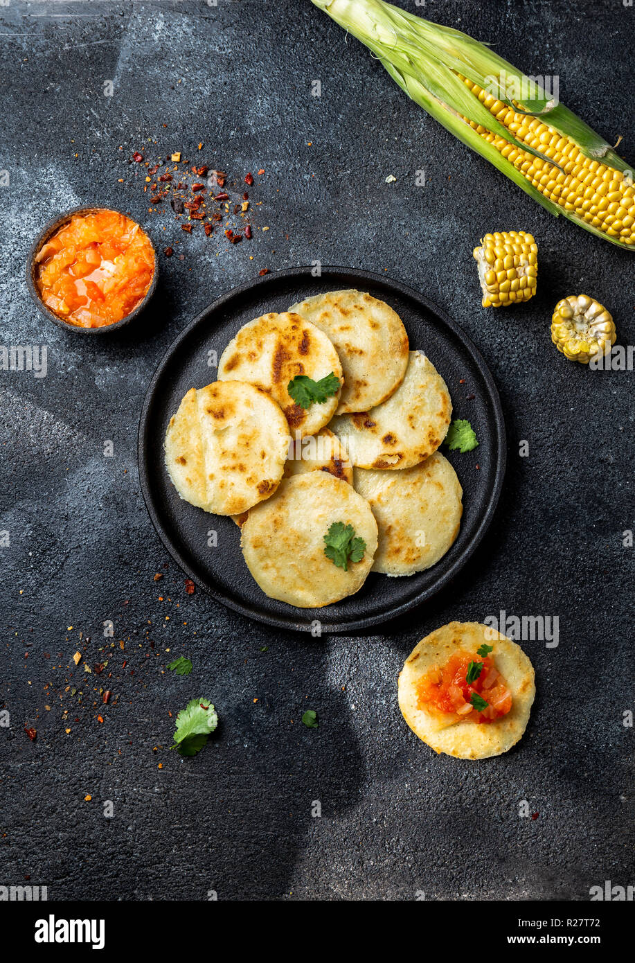 COLOMBIAN FOOD. Maize AREPAS and fried pork chicharron ans colombian ...