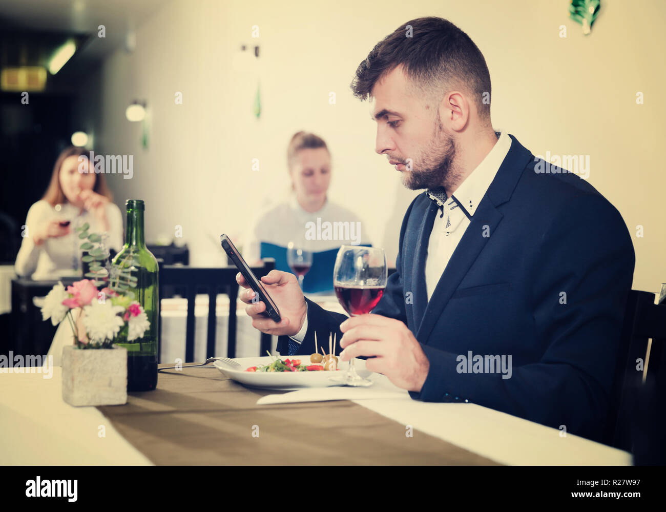 Gentleman is having dinner in luxury restaurante indoor Stock Photo - Alamy