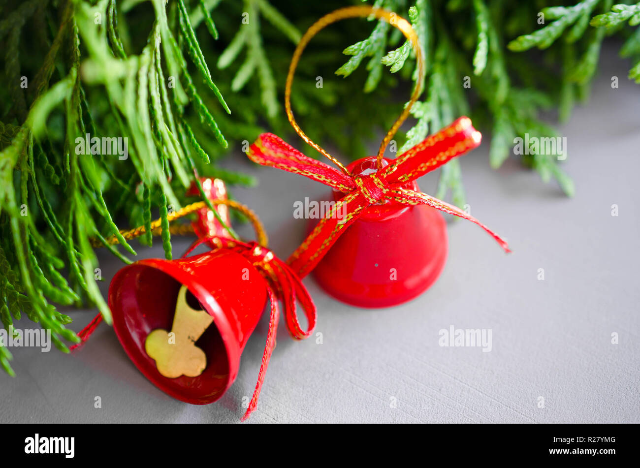 Christmas background with xmas fir branches and red bells. Christmas ...