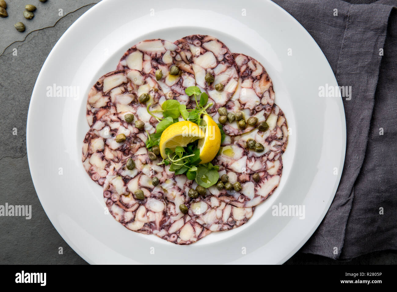 OCTOPUS CARPACCIO. Seafood Raw octopus slices with olive oil, lemon and ...