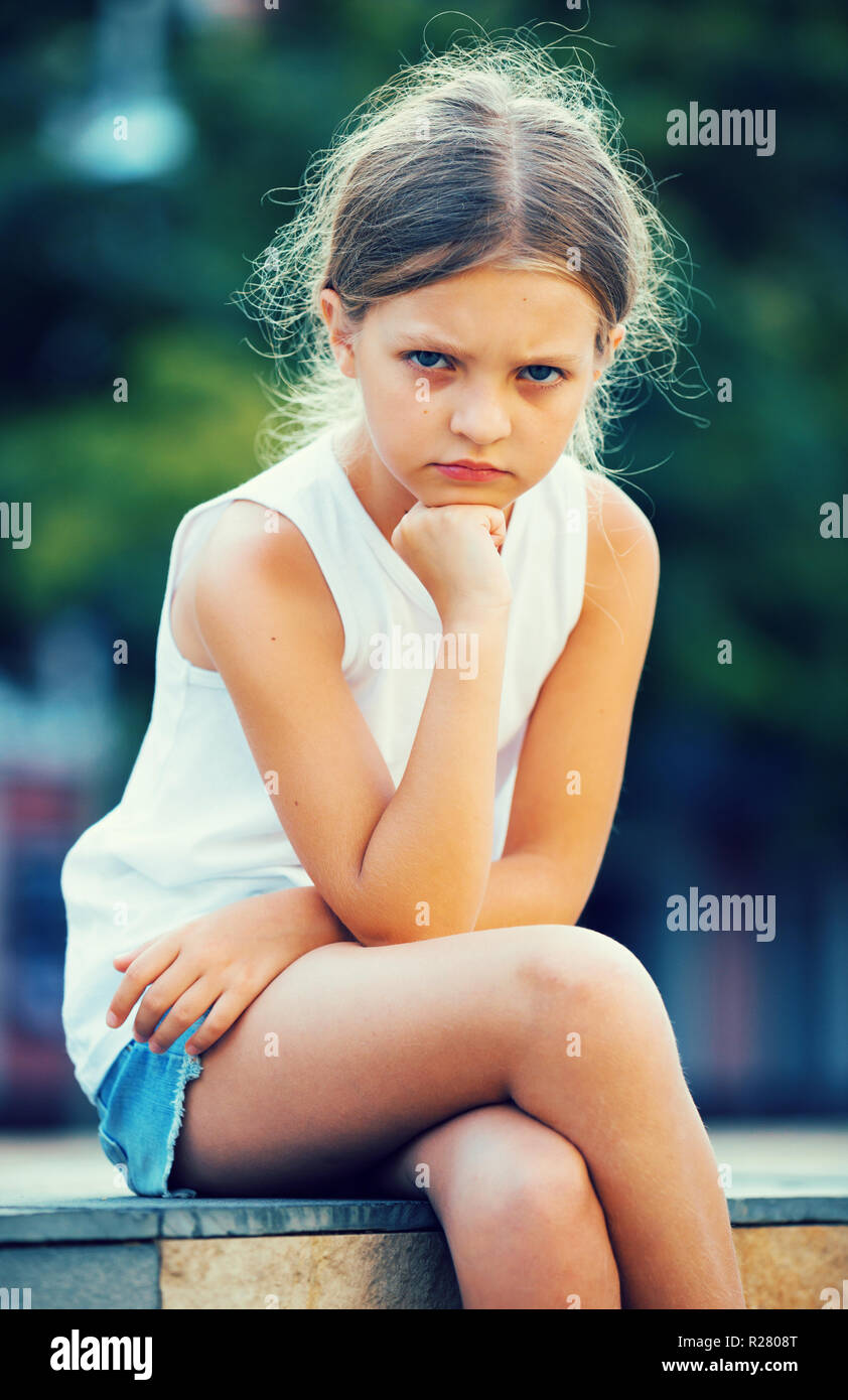 portrait of sad girl being alone and worried outdoors Stock Photo - Alamy