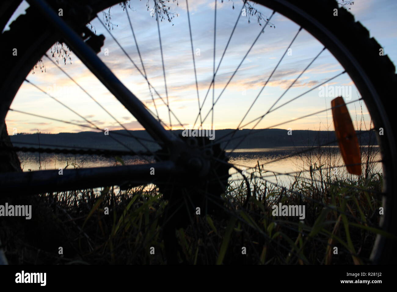 Bicycle on the lake and beautiful landscape Stock Photo - Alamy