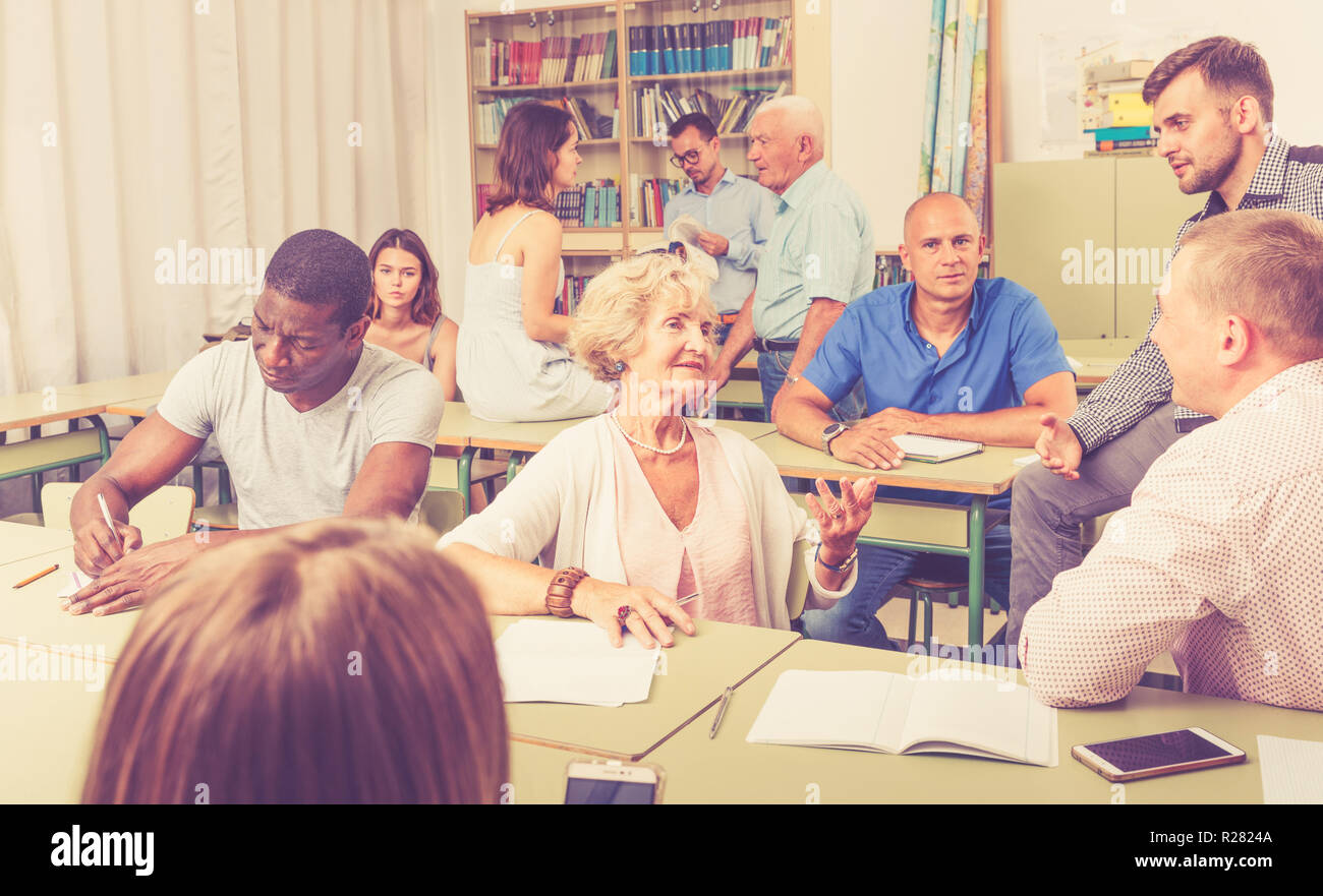 Group students different ages discussion during business course Stock ...