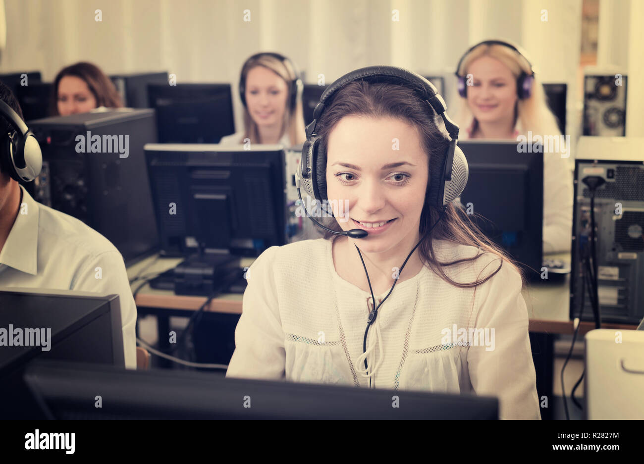 Technical support team working at call center office. Selective focus ...