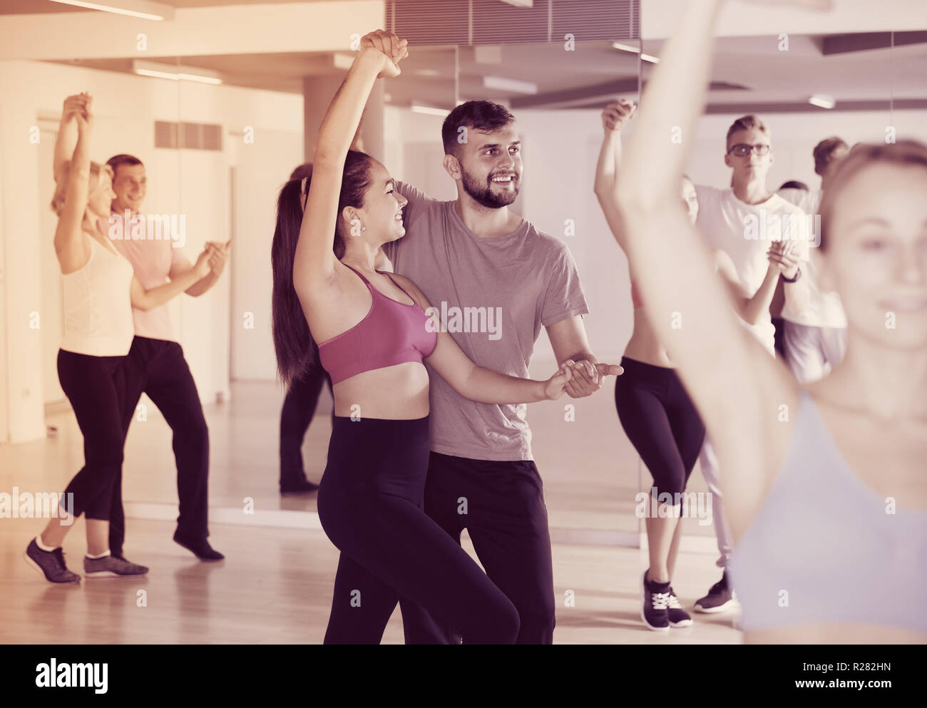 Nice dancing pair dance tango together in studio Stock Photo - Alamy