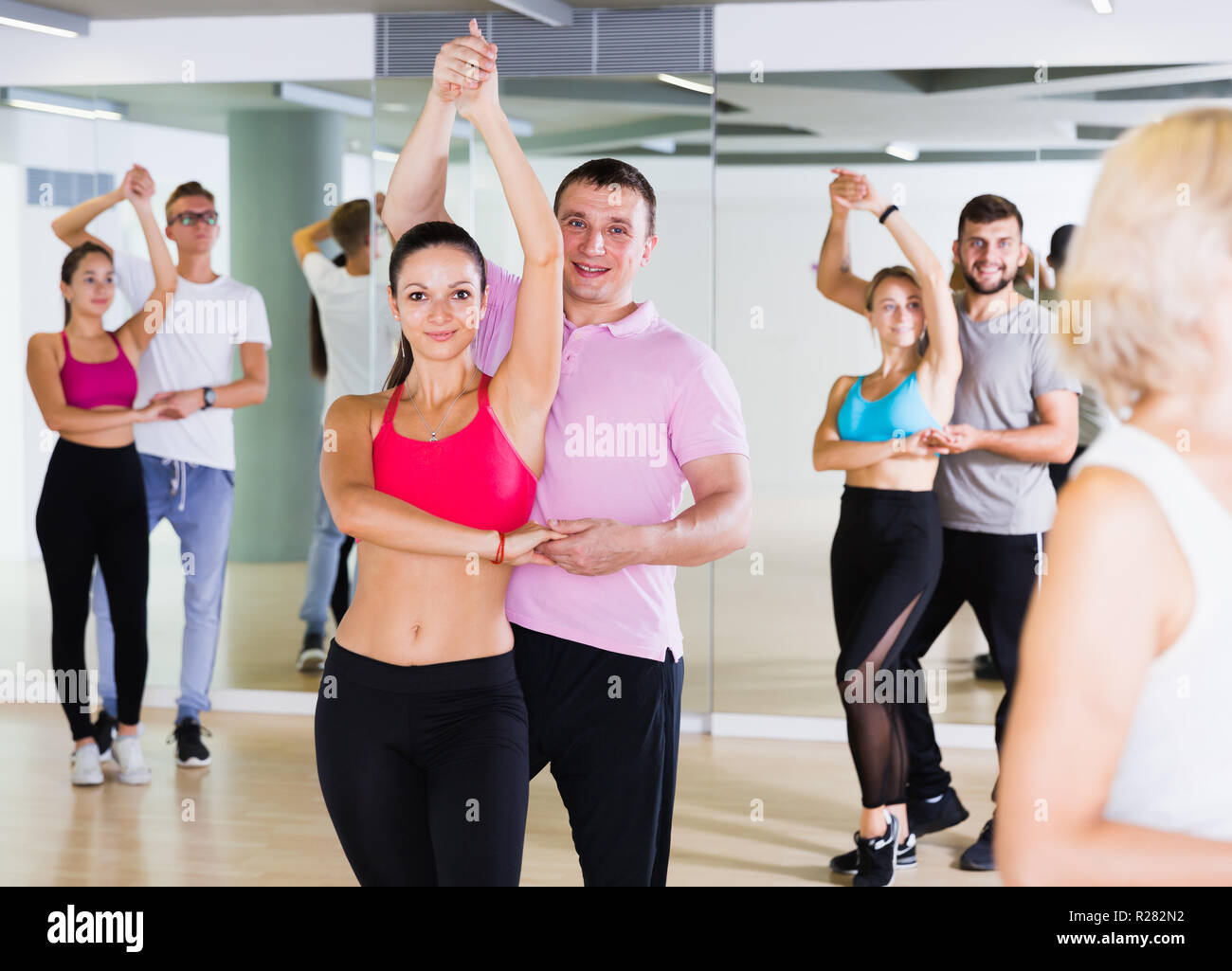 Ordinary dancing pair dance together in studio Stock Photo - Alamy