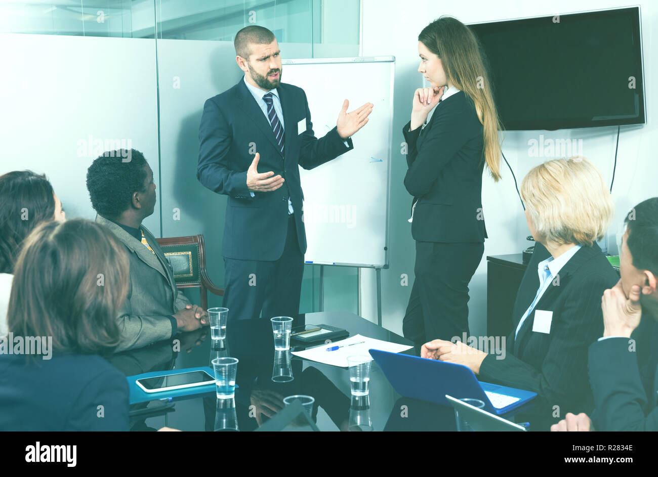 Outraged angry manager expressing his dissatisfaction to female ...