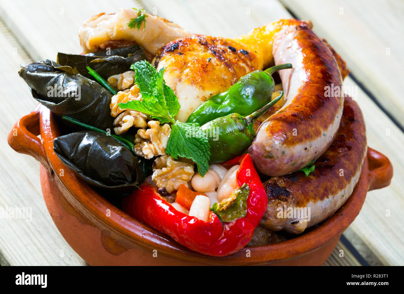 Traditional Bulgarian dish Kapama – sausages, cabbage rolls, dolma and ...