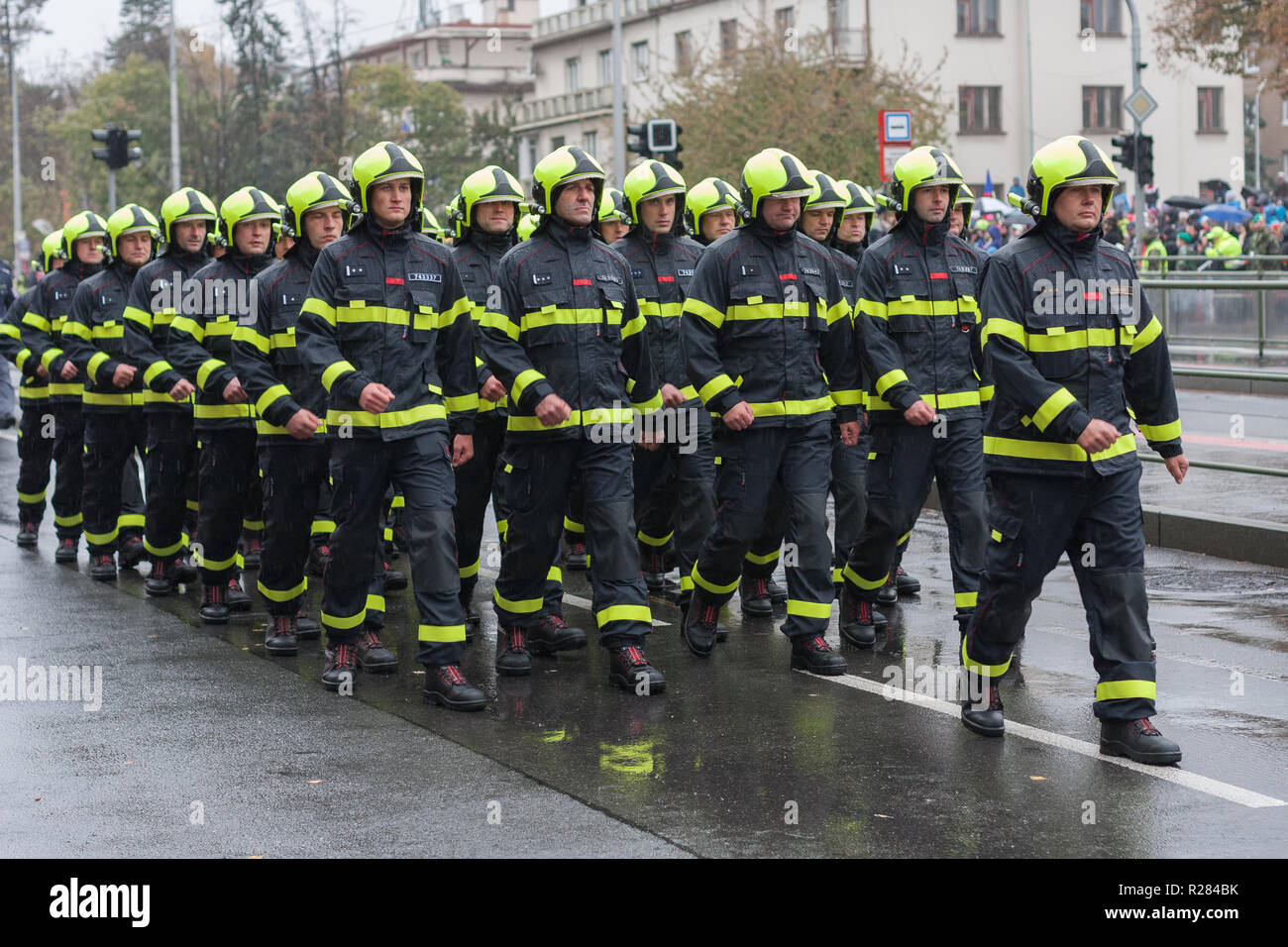 European street, Prague-October 28, 2018: Fire brigade workers are ...