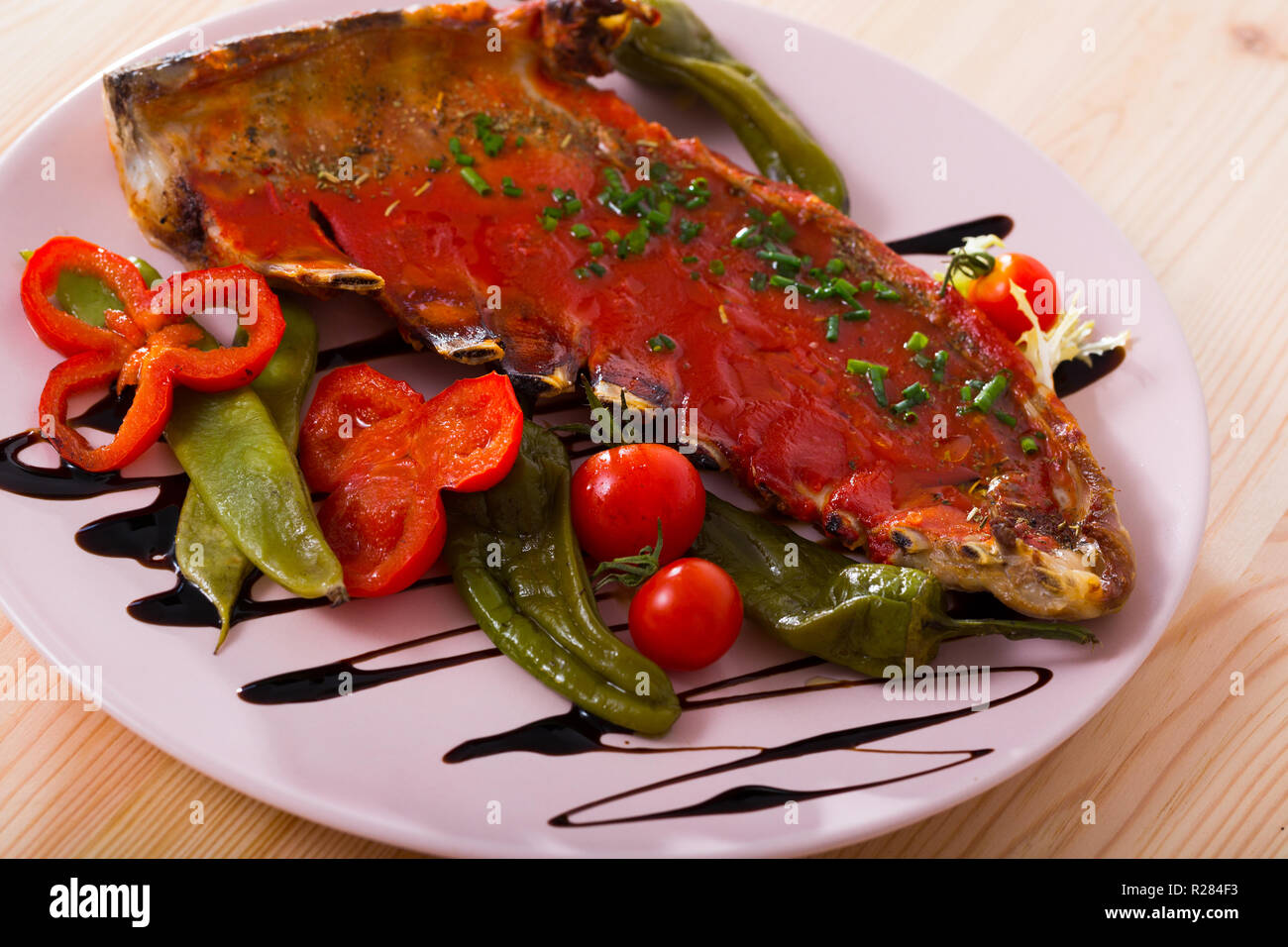 Portion of mutton ribs roasted with chile pepper, served with spicy ...