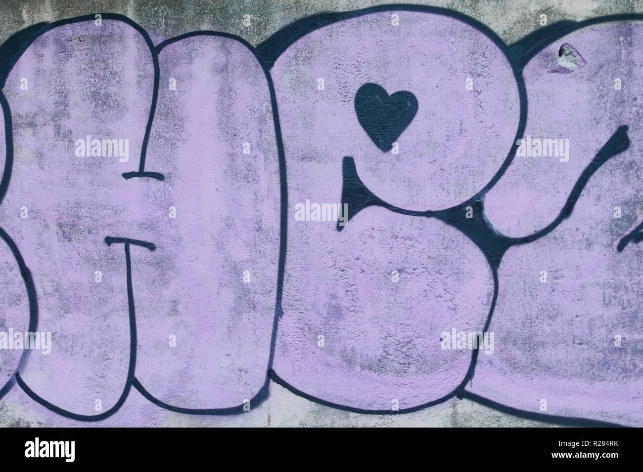 Violet graffiti on a concrete wall texture a background Stock Photo - Alamy