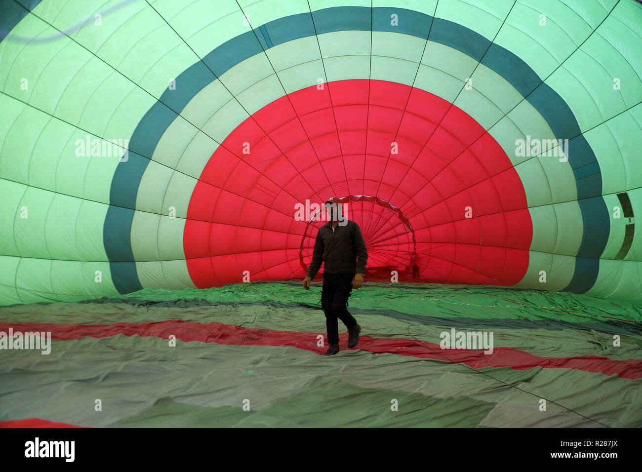 Pokhara, Nepal. 17th November 2018. A crew member prepares hot air ...