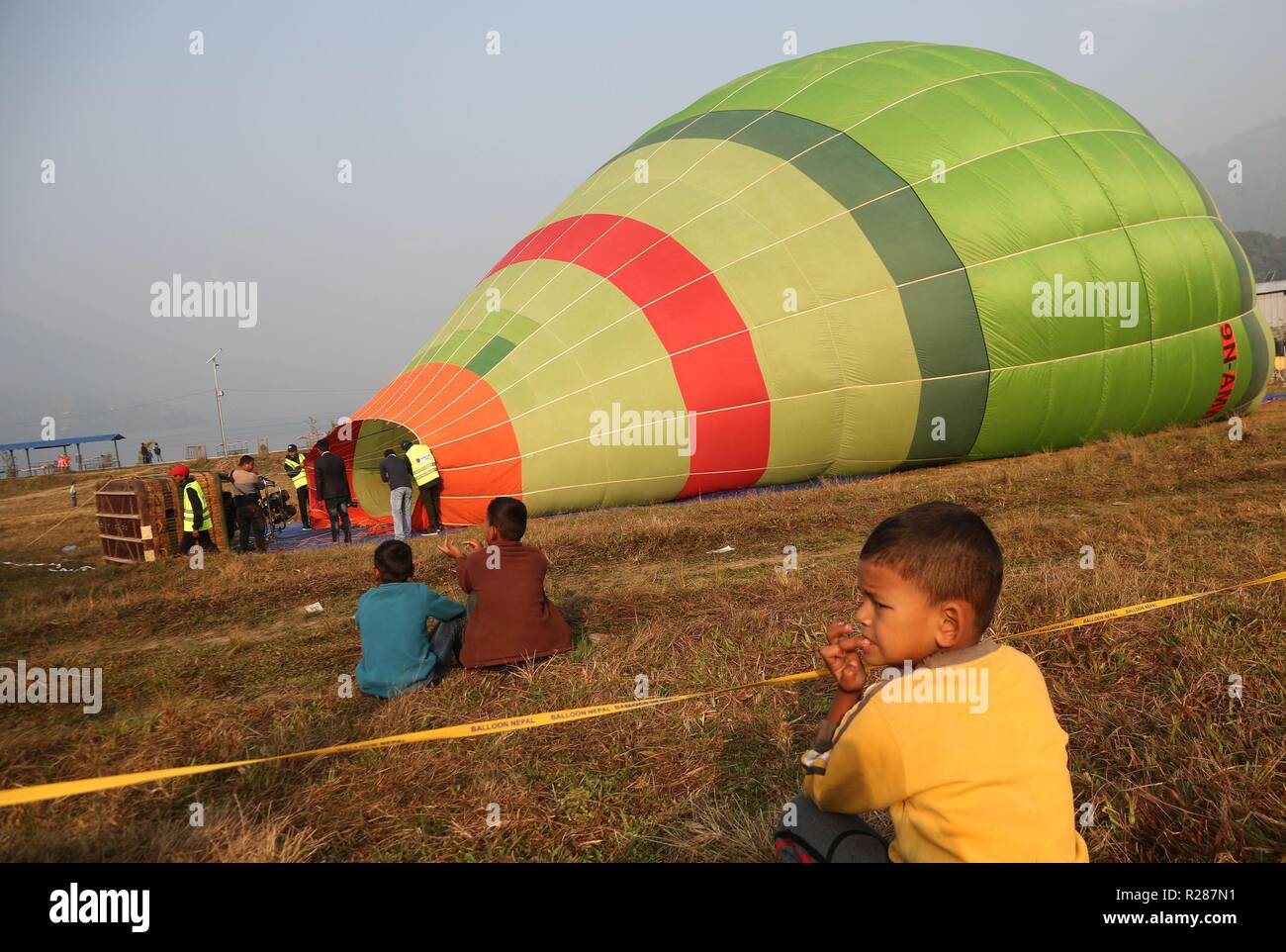 Pokhara, Nepal. 17th November 2018. Local kids enjoy the preparation of ...