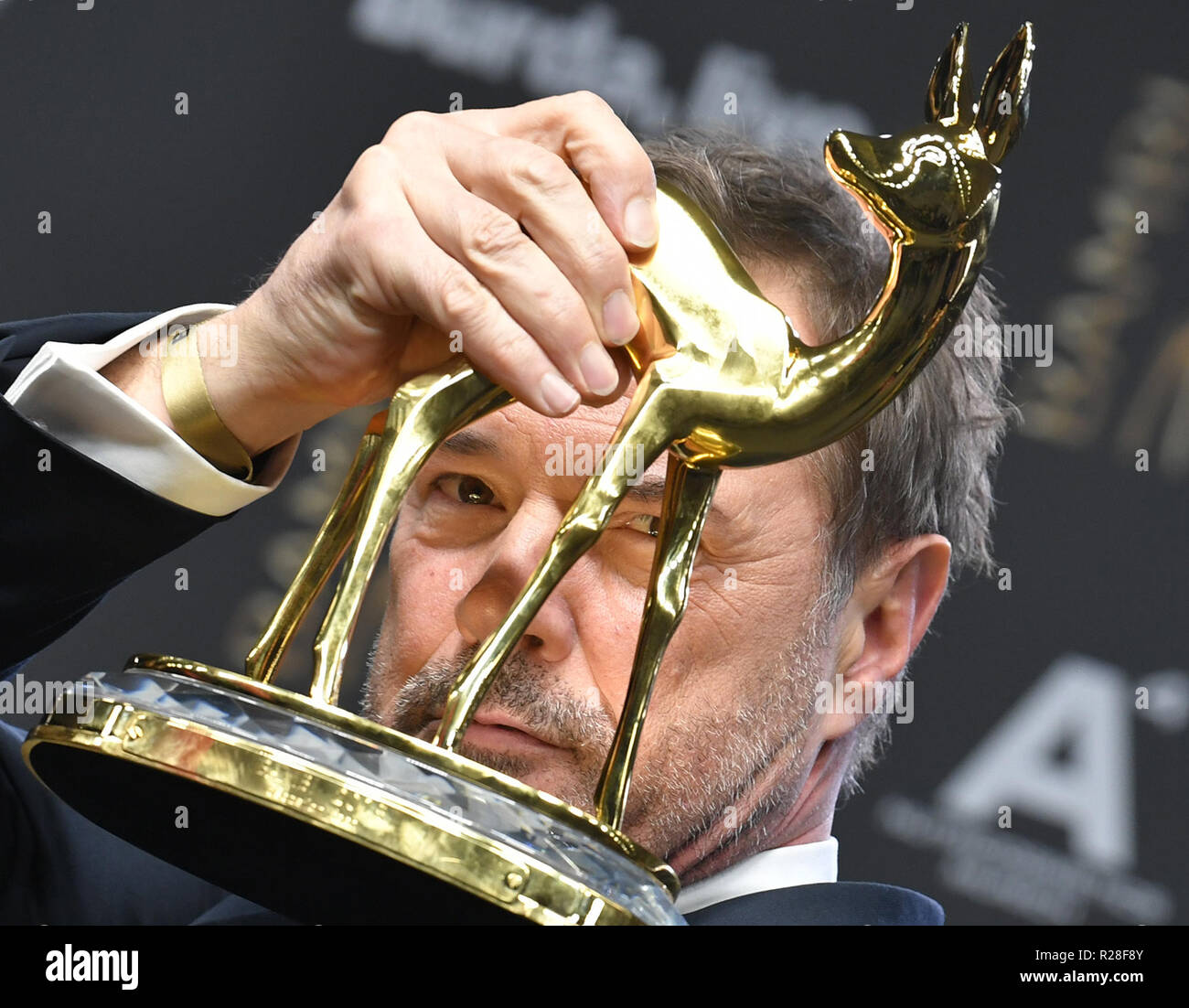 Berlin, Germany. 16th Nov, 2018. Sebastian Koch holds his prize in the ...