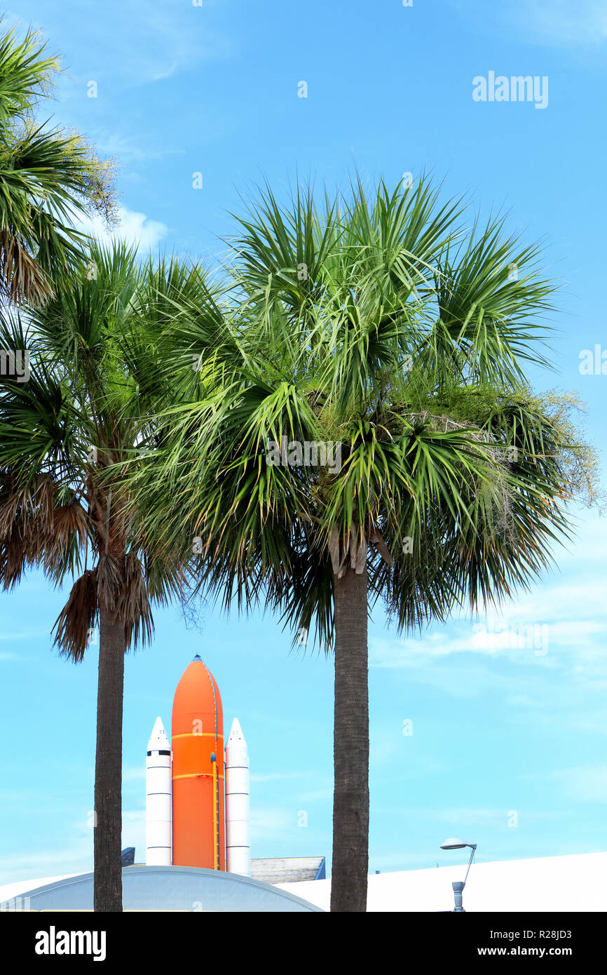 Kennedy space center entrance with space rocket and palm trees over ...