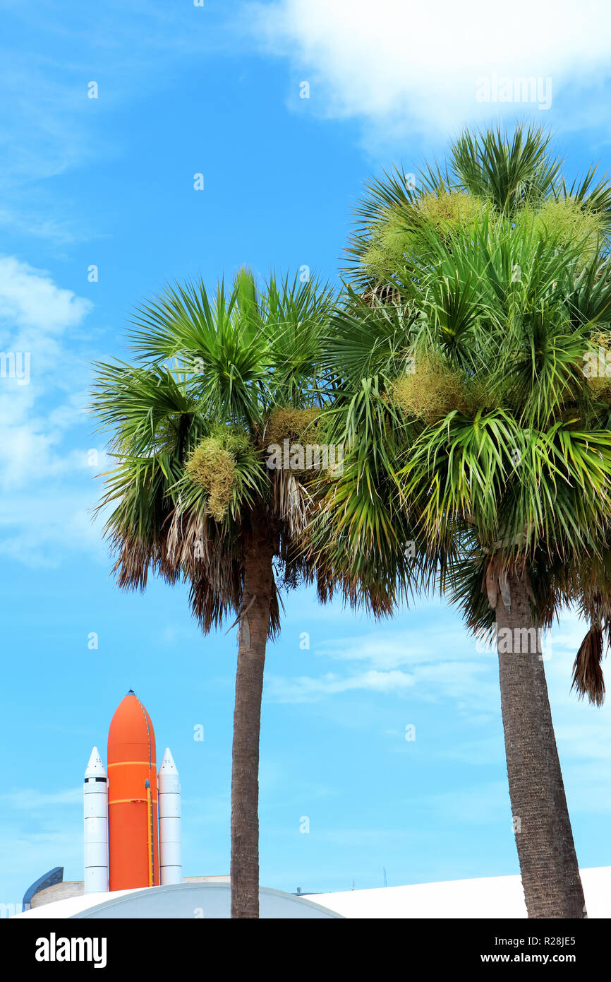 Kennedy space center entrance with space rocket and palm trees over ...