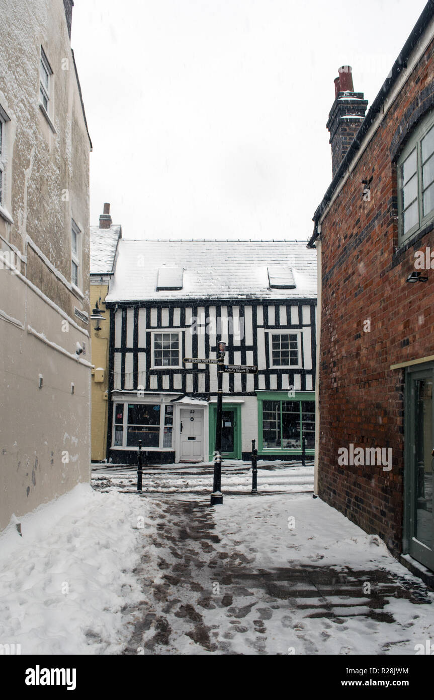 A stunning British scenery with traditional wooden and bricks houses in ...