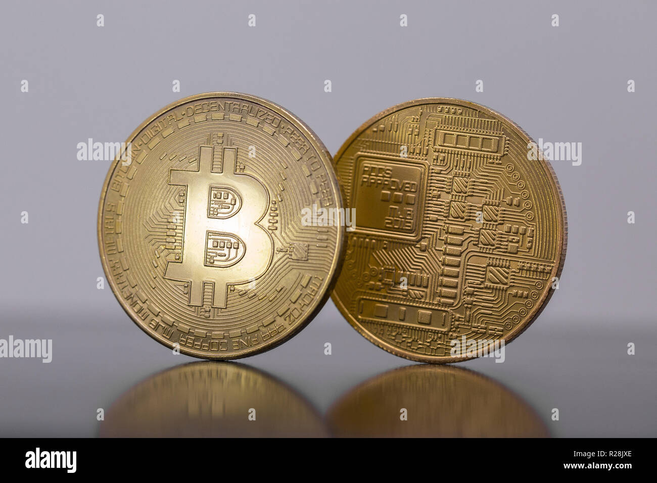 Bitcoin cryptocurrency physical coin shown from both sides in white ...