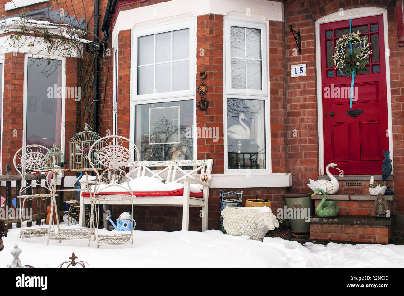 A fantastic English winter garden with all the furniture covered by the ...