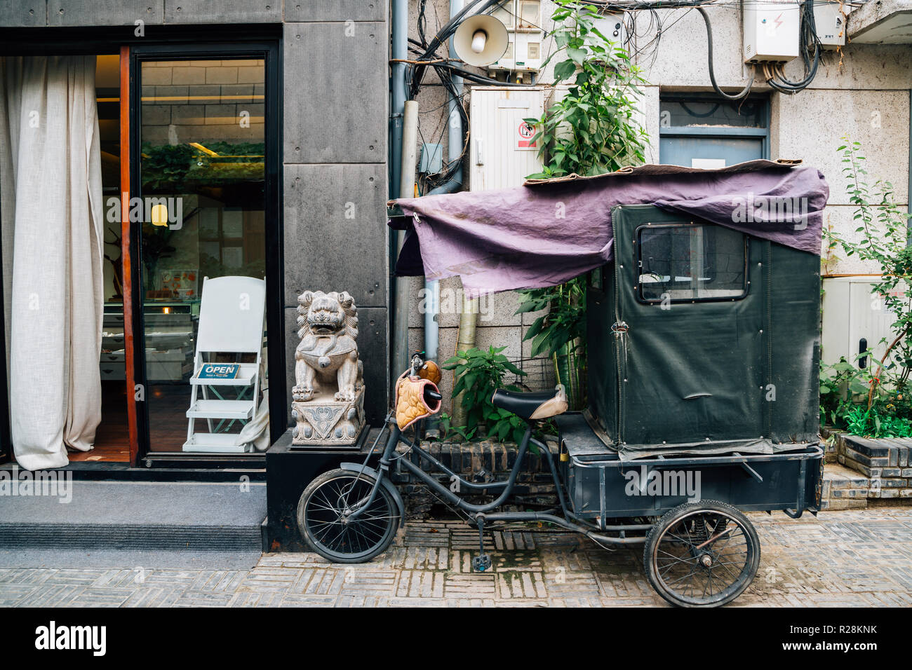 Chinese old street Hutong and traditional rickshaw in Beijing, China ...