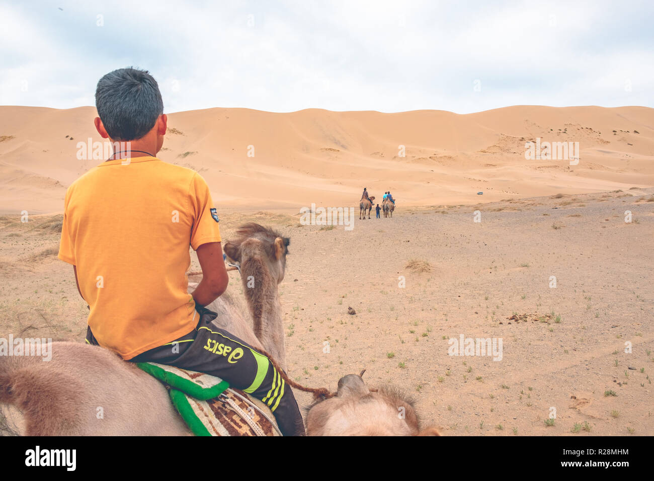 Desert with camel herders hi-res stock photography and images - Alamy