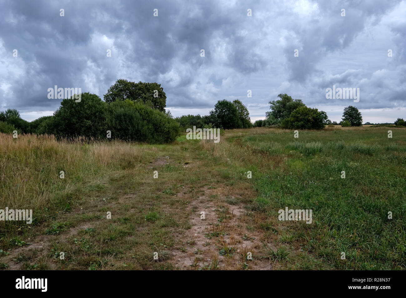 storm clouds forming over the countryside and fields with roads Stock ...