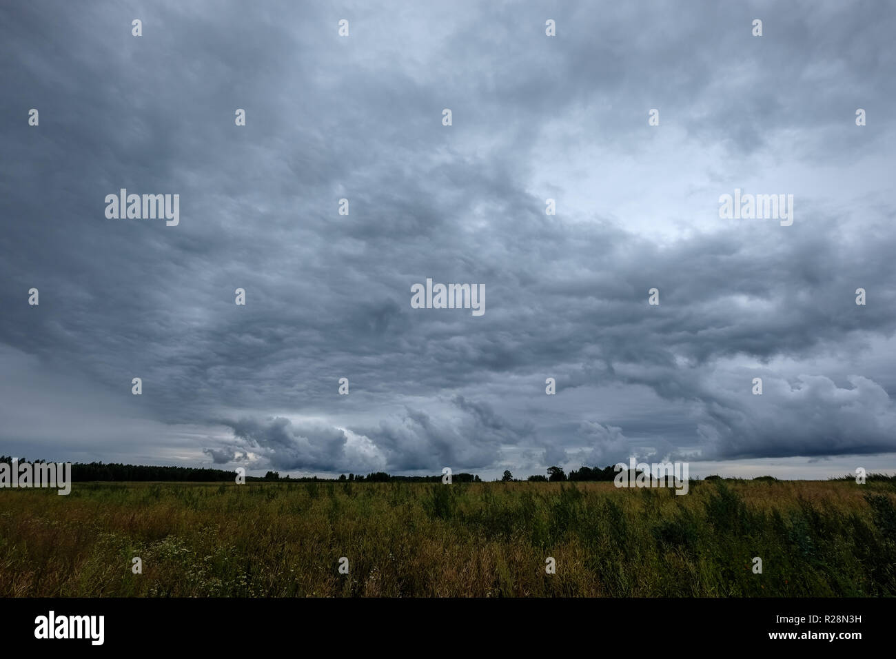storm clouds forming over the countryside and fields with roads Stock ...