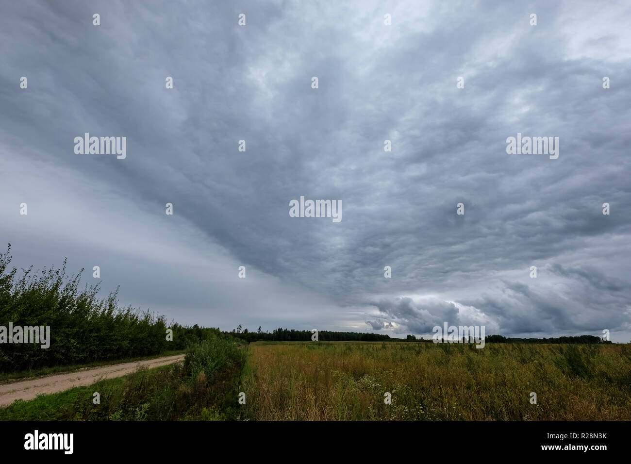 storm clouds forming over the countryside and fields with roads Stock ...