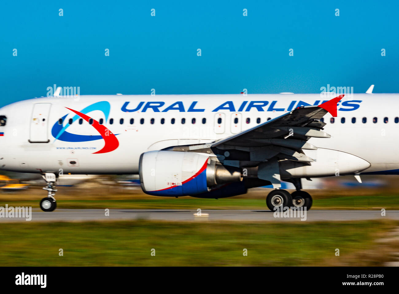 The plane takes off at dawn at high speed. Photo from the runway ...