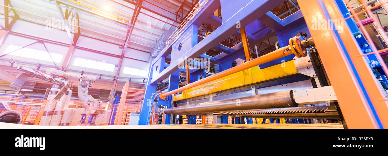 Fiberglass production industry equipment at manufacture background ...