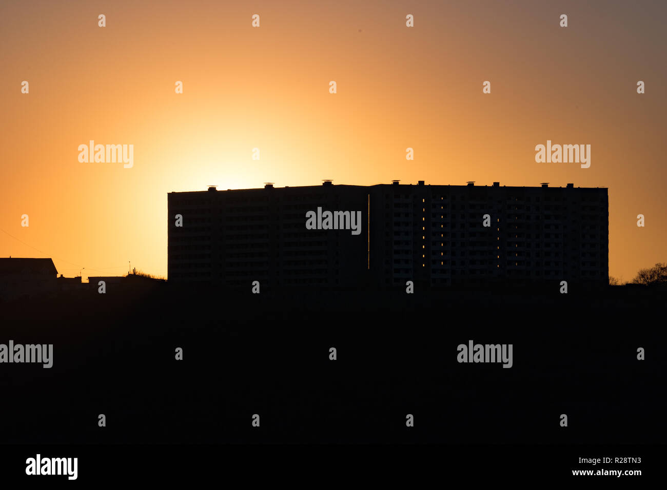 urban landscape with silhouettes of high-rise buildings in the ...