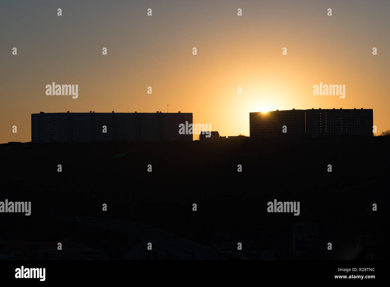 urban landscape with silhouettes of high-rise buildings in the ...