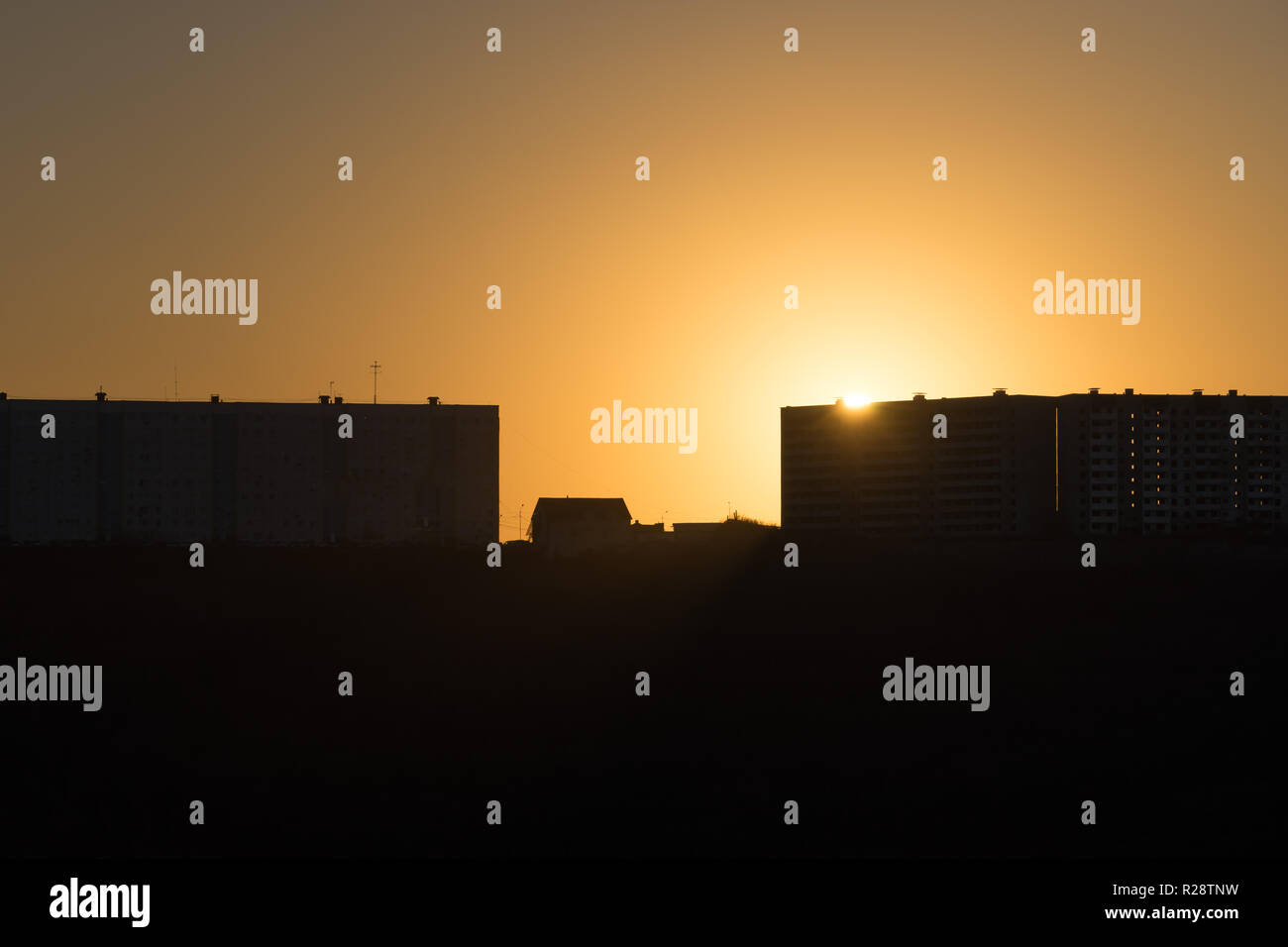 urban landscape with silhouettes of high-rise buildings in the ...