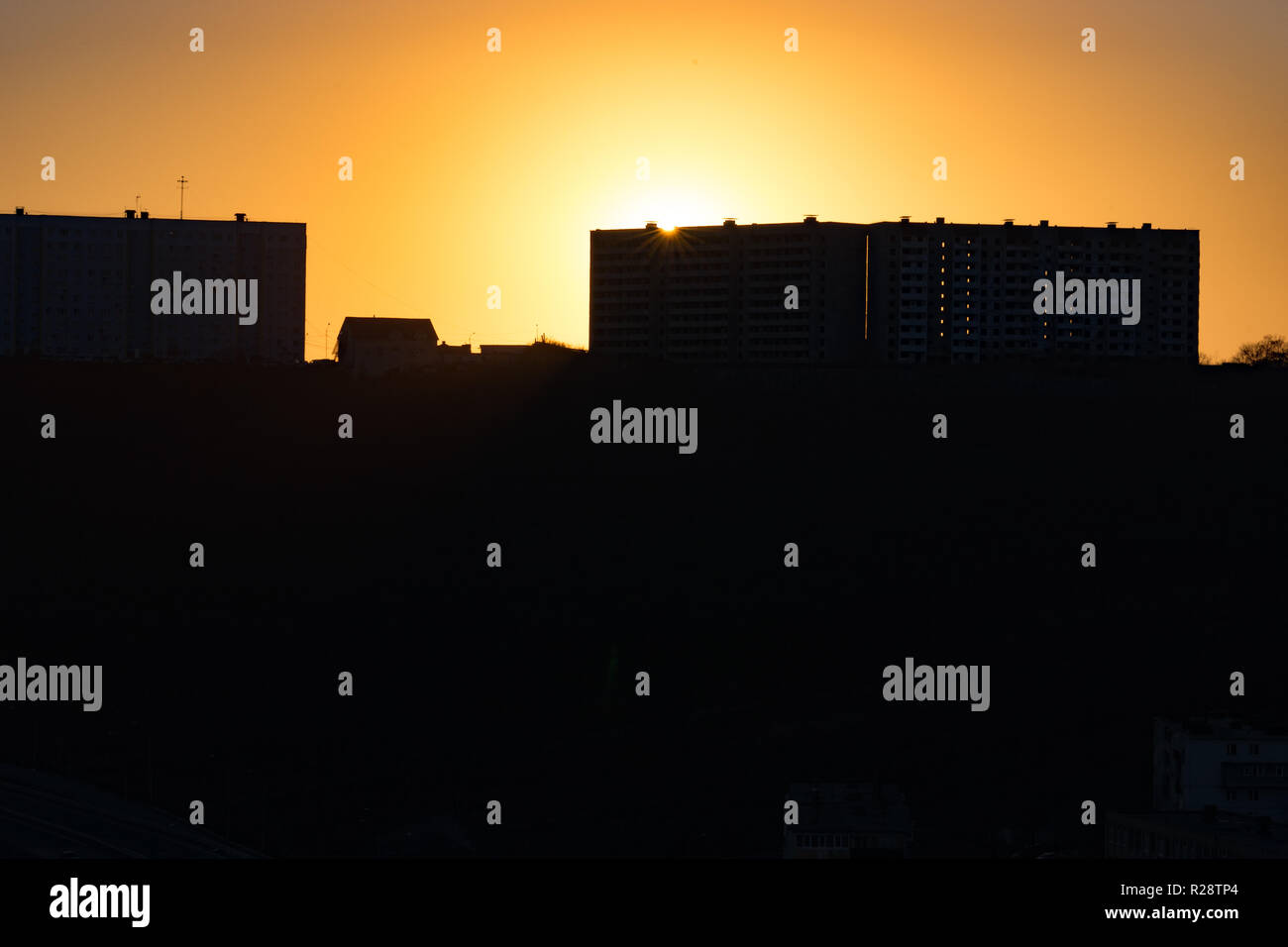urban landscape with silhouettes of high-rise buildings in the ...