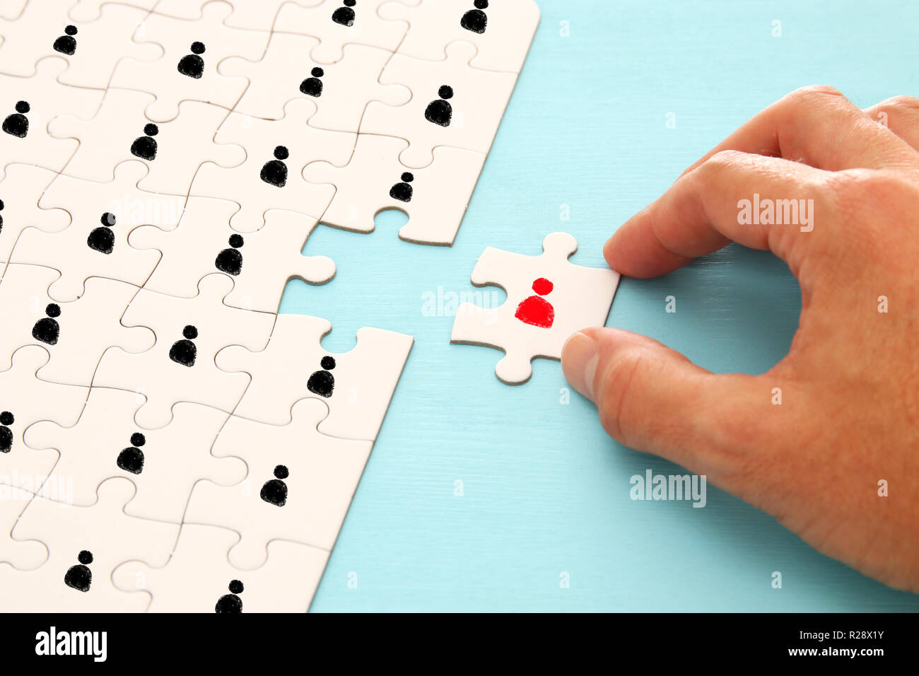 image of puzzle with people icons over wooden table ,human resources ...