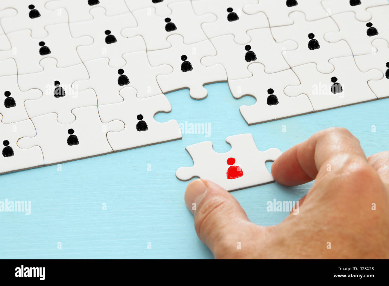 image of puzzle with people icons over wooden table ,human resources ...