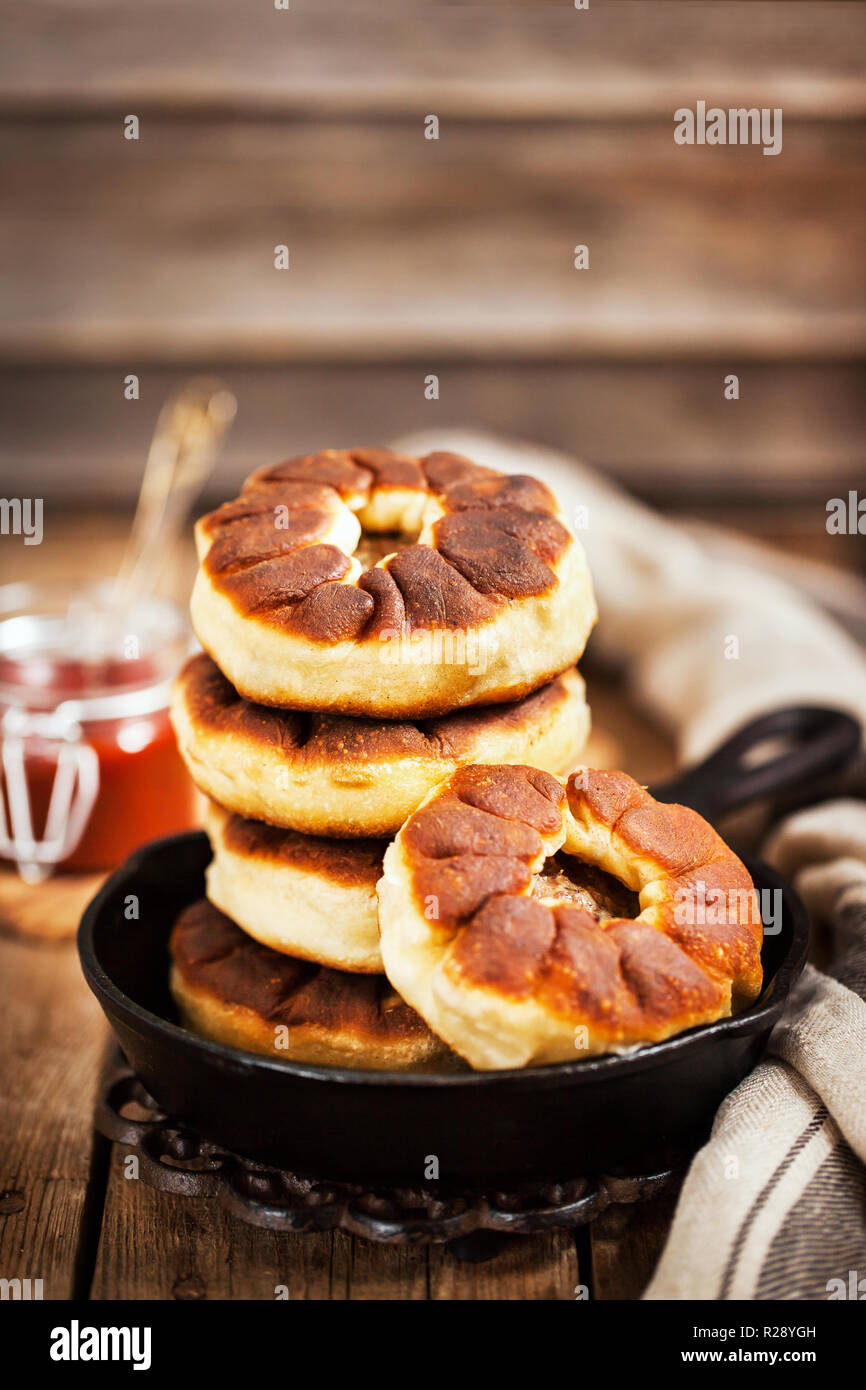 Traditional Russian deep fried meat patties (belyash) on rustic ...
