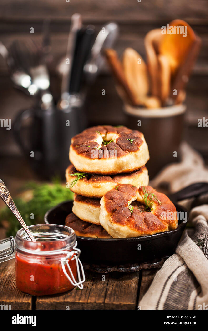 Traditional Russian deep fried meat patties (belyash) on rustic ...