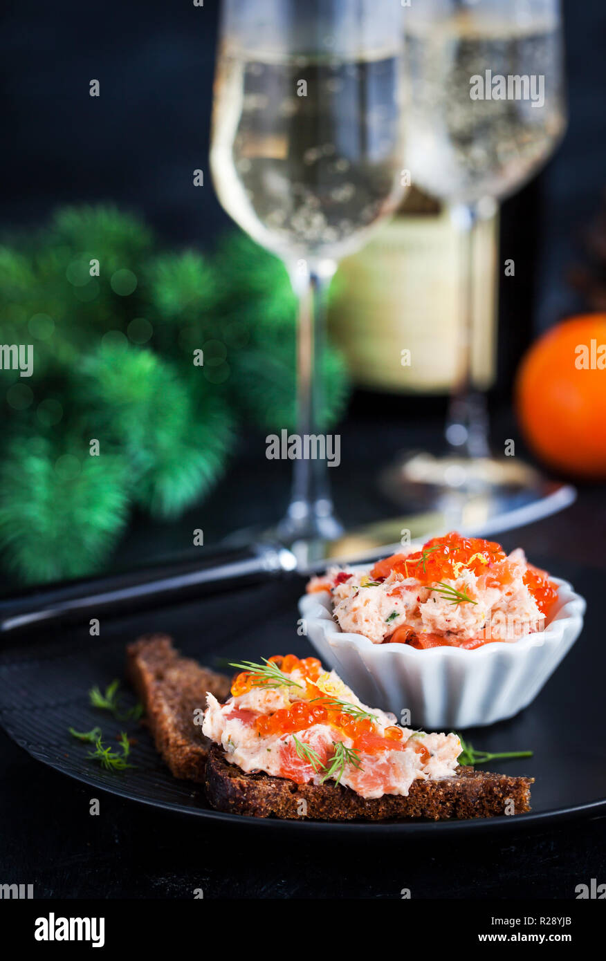 Salmon pate (rillettes) with red caviar served with sliced bread Stock ...