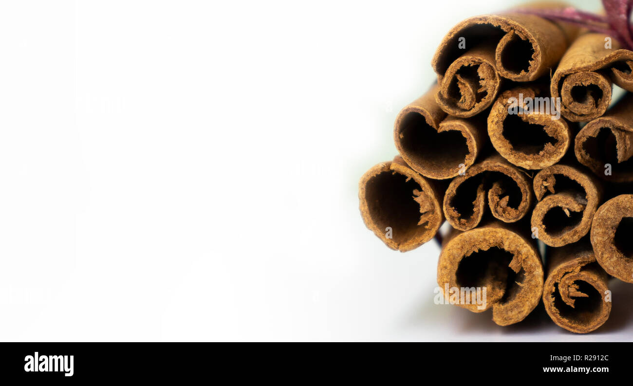 Cinnamon sticks close-up isolated on white background Stock Photo - Alamy