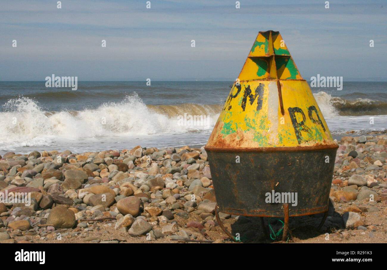 A large metal buoy on a beach in South Wales, UK Stock Photo - Alamy
