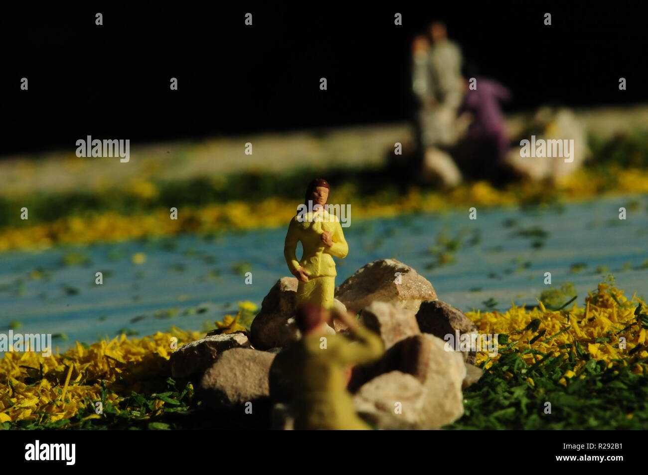 miniature figures woman and man taking fotos at the lake Stock Photo ...